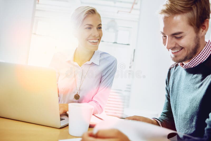 The Make a Great Team. Two Young Businesspeople in the Office. Stock ...