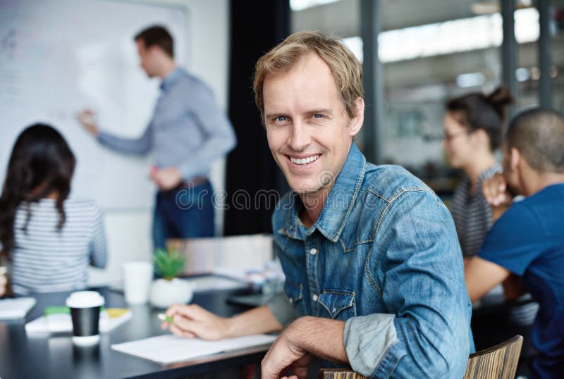 We Make Ideas a Reality. Portrait of an Office Worker with His ...