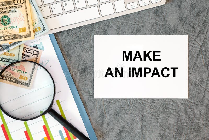MAKE AN IMPACT Is Written In A Document On The Office Desk, Money And ...