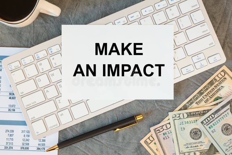 MAKE an IMPACT is Written in a Document on the Office Desk, Money and ...