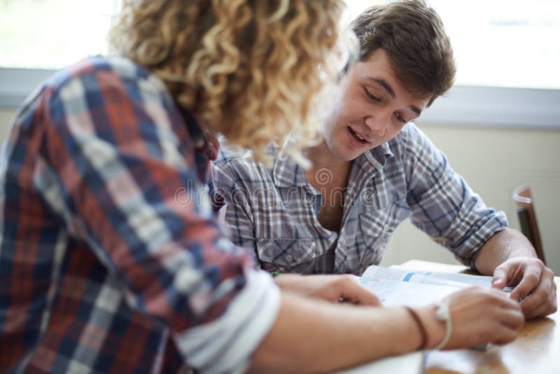 Make Light of Hard Work. Shot of Young Male College Students Studying ...