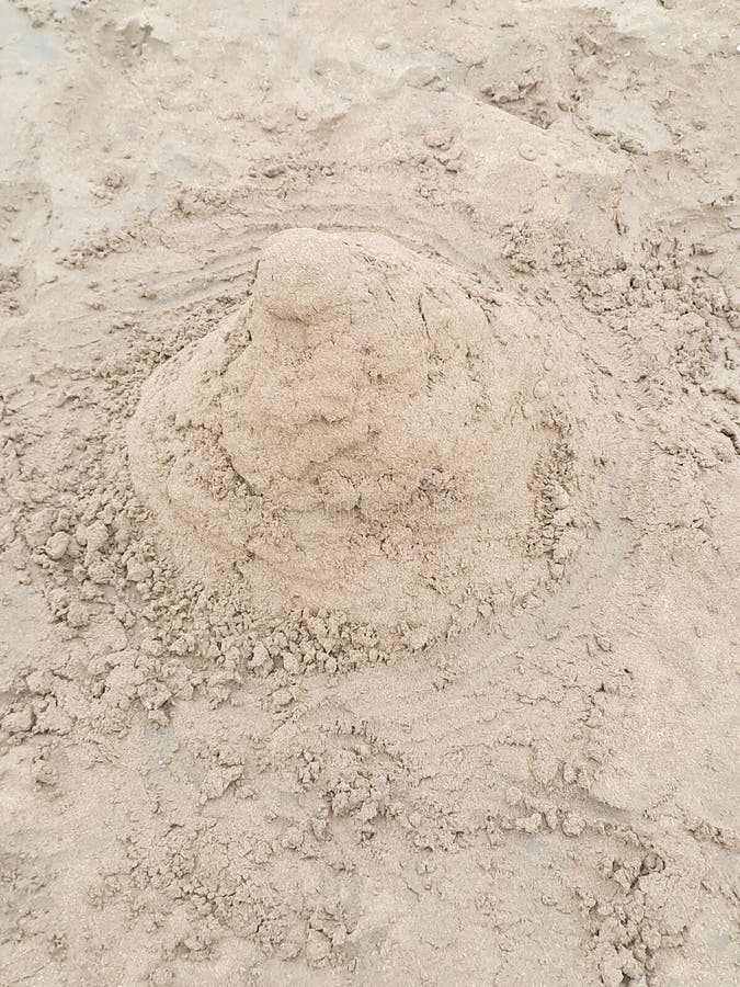 Make a Mountain Using Beach Sand on the Beach. Stock Image - Image of ...