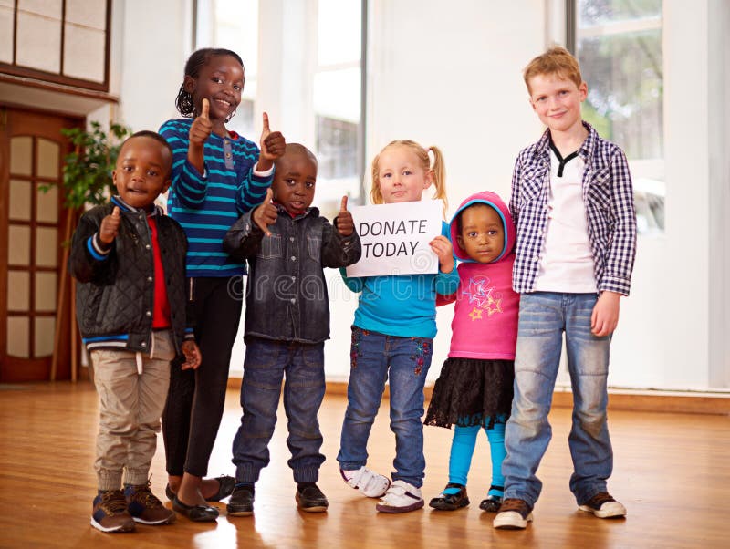 Make Our Day. a Group of Children Holding Up a Donate Today Sign. Stock ...