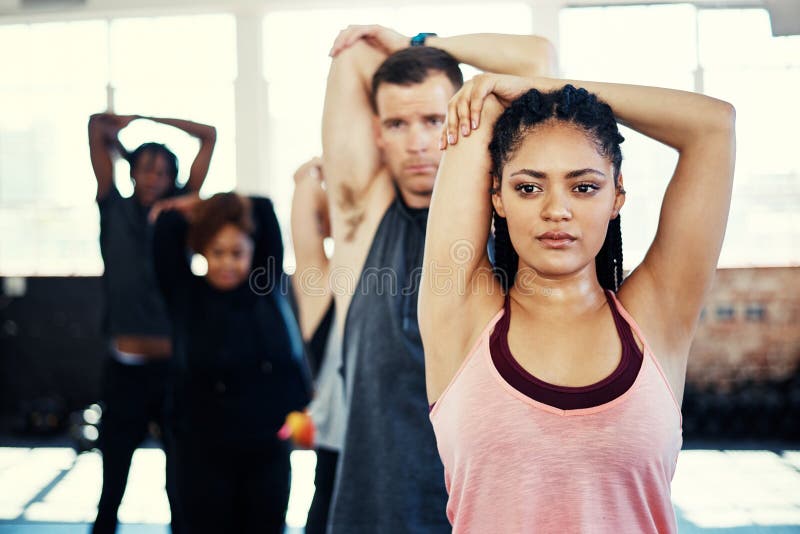 Make Sure To Keep Your Posture Right. a Focused Group of Young People ...