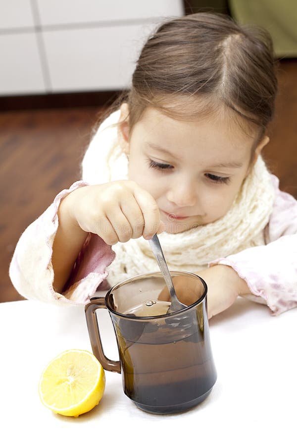 Child drinking tea stock image. Image of drinking, knitted - 34029657