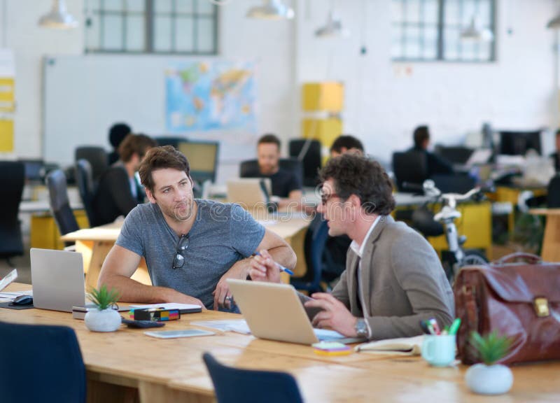 We Make Technology Work for Us. Shot of Business Colleagues Discussing ...
