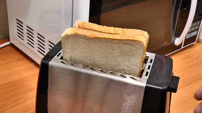 Make Toast. Making Sandwiches on an Electric Grill. a White Toast Loaf ...