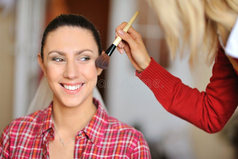 Make-up artist in action stock image. Image of beauty - 27952699