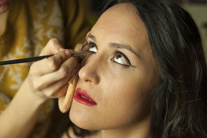 Make-up Artist Applying Cosmetics To a Model in a Set Stock Image ...