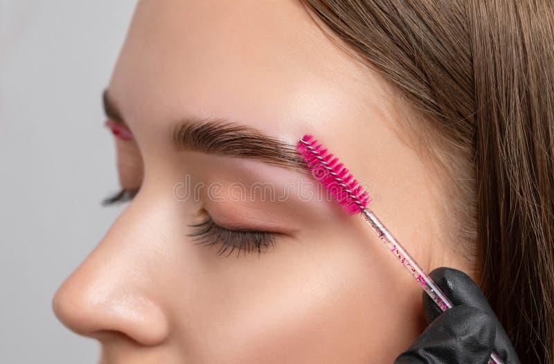 The Make-up Artist Does Long-lasting Styling of the Eyebrows of the ...