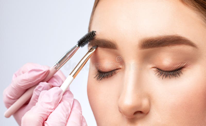 The Make-up Artist Does Long-lasting Styling of the Eyebrows of the ...