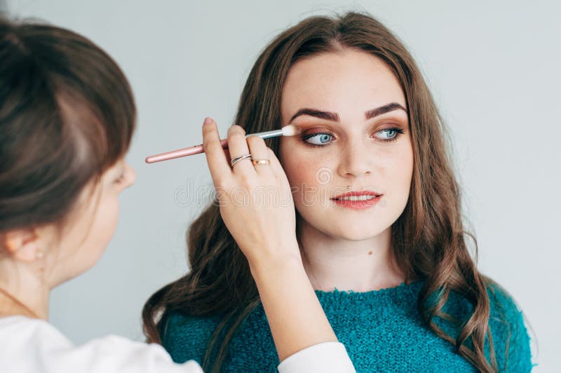 Make-up Artist Does the Make-up of the Girl Stock Image - Image of hair ...