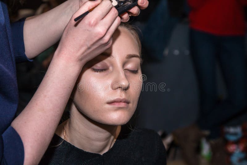 Make-up Artist Doing the Make-up for Nice Girl Stock Photo - Image of ...