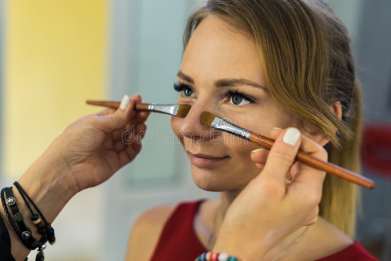 Make-up Artist Doing Makeup To Beautiful Young Girl Stock Photo - Image ...