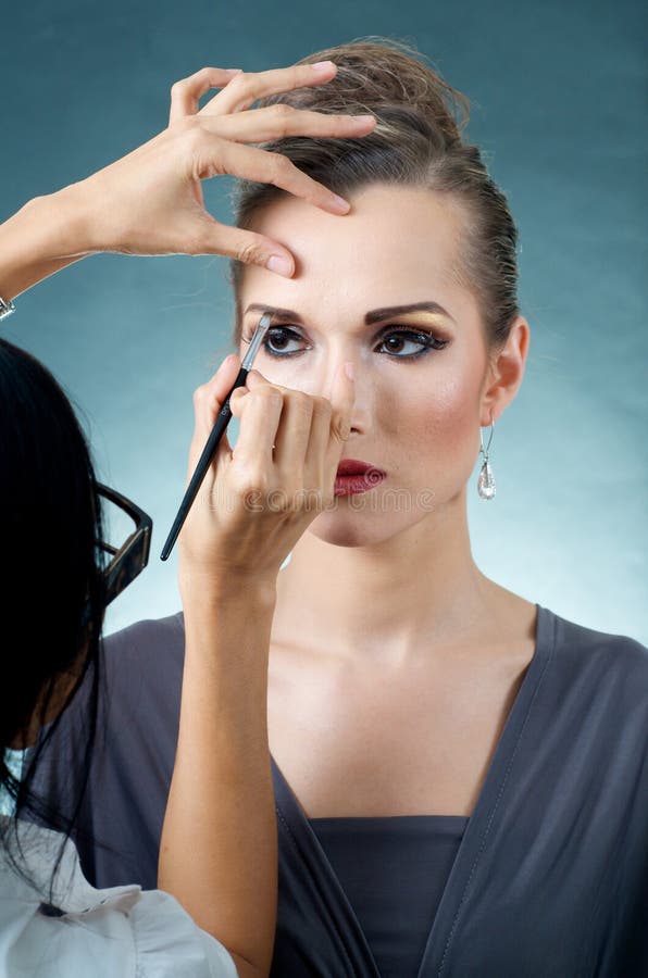 Woman Looking at Mirror and Putting Make Up Stock Image - Image of ...