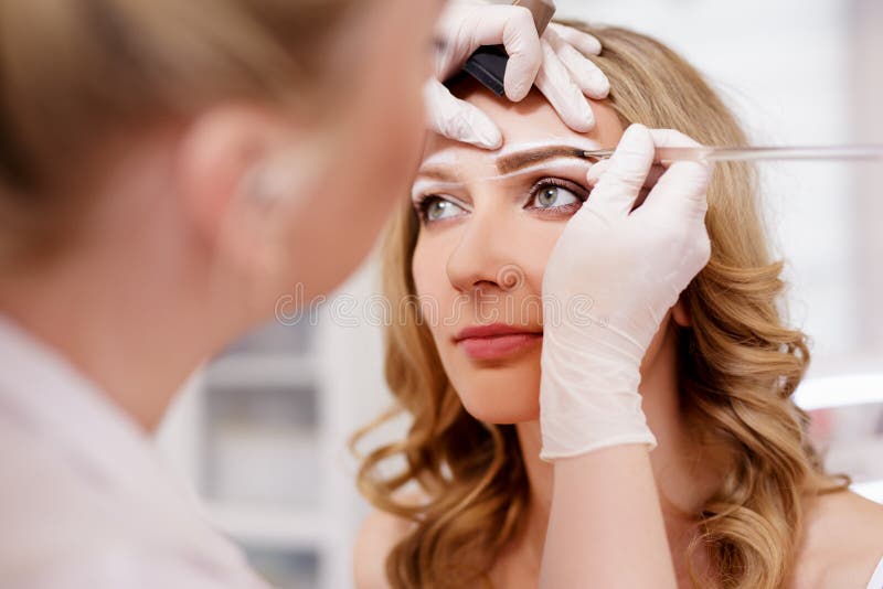 Make Up and Beauty Concept - Make Up Artist Painting Eyebrows Stock ...