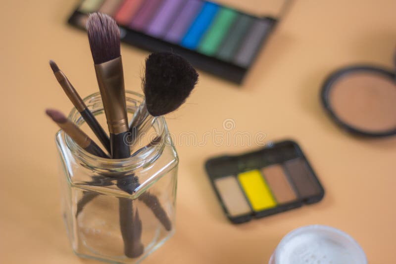 Make Up Elements on a Table Stock Photo - Image of colorful, powder ...