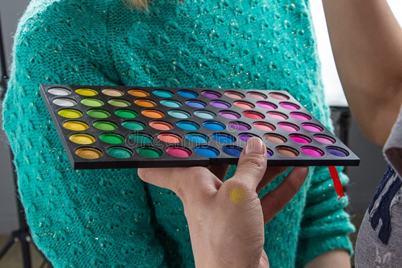 Make up palette in hand stock image. Image of eyeshadow - 40300289