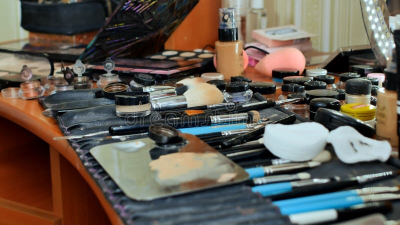 The Make-up Worker`s Desk. Many Cosmetics are Scattered on the Table ...