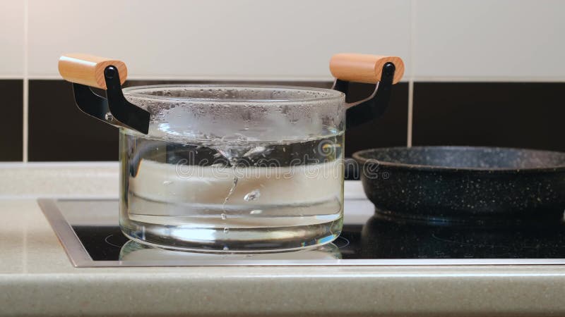 Make a Whirlpool in Boiling Water and Drop an Egg Stock Video - Video ...