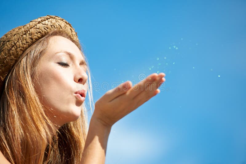 Make a Wish...a Beautiful Young Woman Blowing Glitter. Stock Photo ...