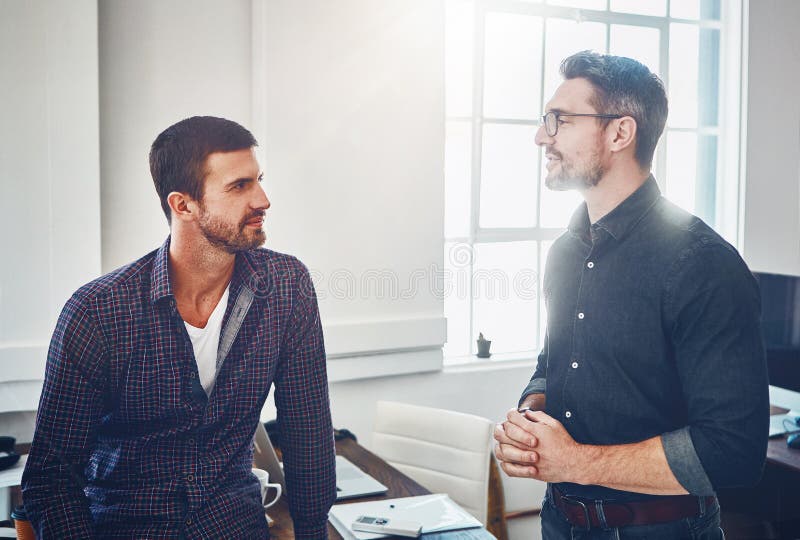 Make Your Mind Deliver. Colleagues Talking in the Office. Stock Photo ...