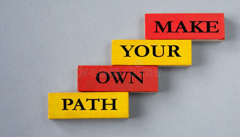 MAKE YOUR OWN PATH - Words on Colorful Wooden Blocks on a Grey ...