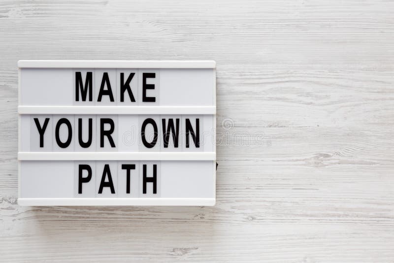 `Make Your Own Path` Words on a Lightbox on a White Wooden Surface, Top ...