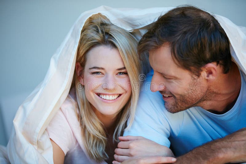 He Makes Me Light Up on the Inside. Portrait of a Young Couple Lying in ...