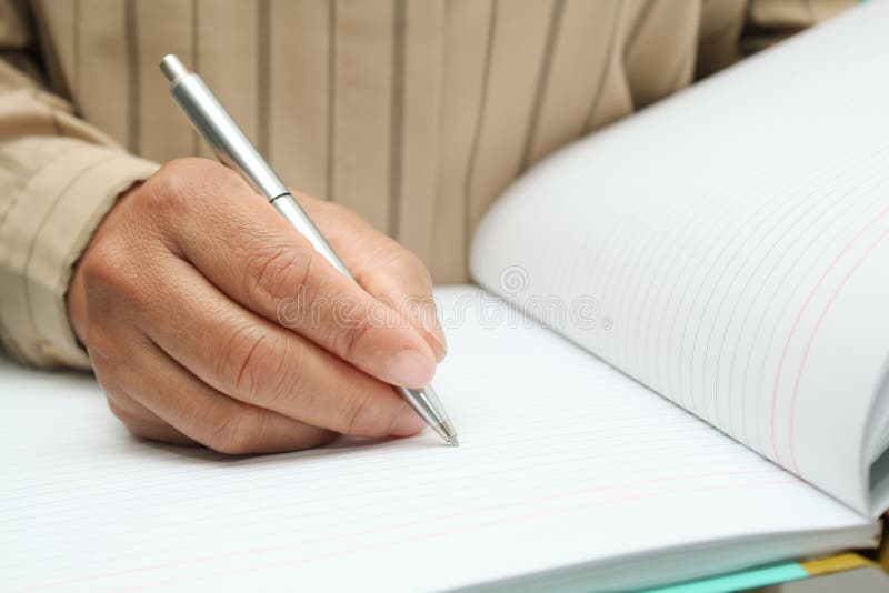 Makes a note in notebook. stock image. Image of human - 47348709