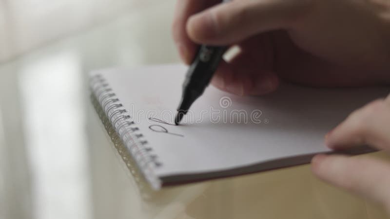 Makes a Plan of Action in a Notebook with a Marker and Pen. Writes Down ...