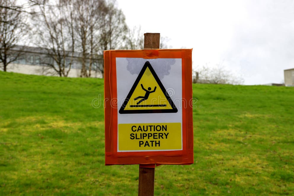 Makeshift Caution Slippery Path Signpost on a Rural Footpath Stock ...