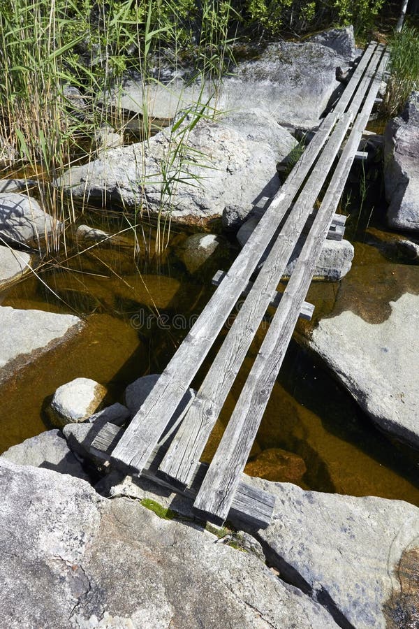 Makeshift Wooden Bridge Over Water Stock Image - Image of wooden ...