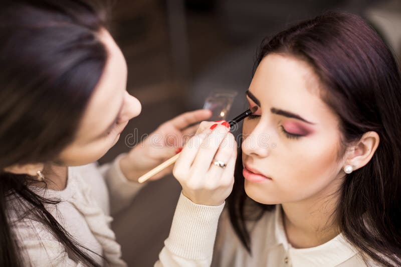 Makeup artist apply makeup stock image. Image of fashion - 68961929