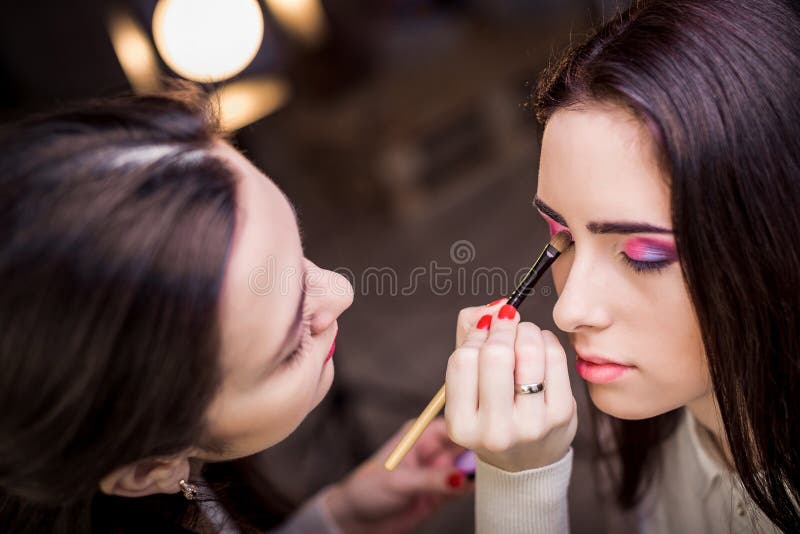 Makeup artist apply makeup stock photo. Image of color - 68962016