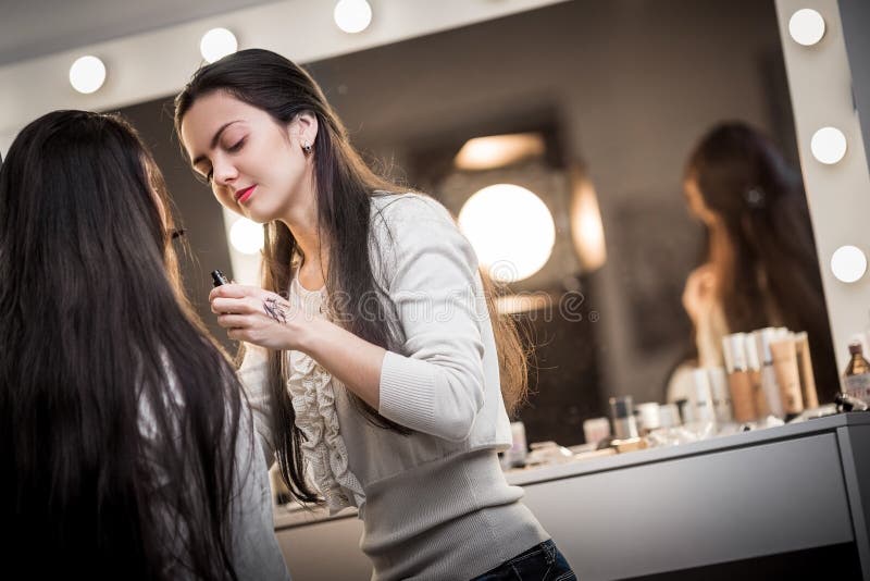 Makeup artist apply makeup stock photo. Image of beautiful - 68962114