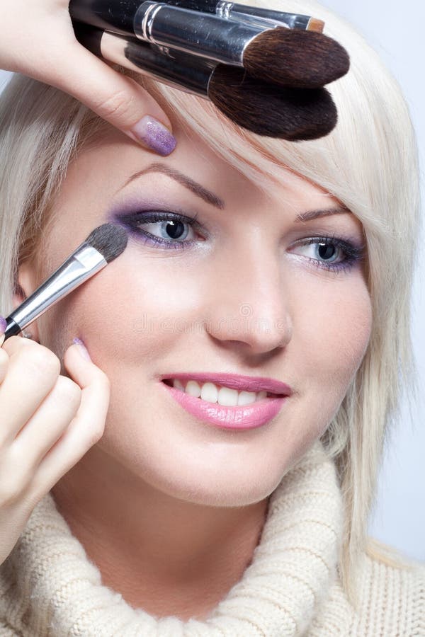 Makeup Artist Applying Eyeshadow Stock Photo - Image of blusher, happy ...
