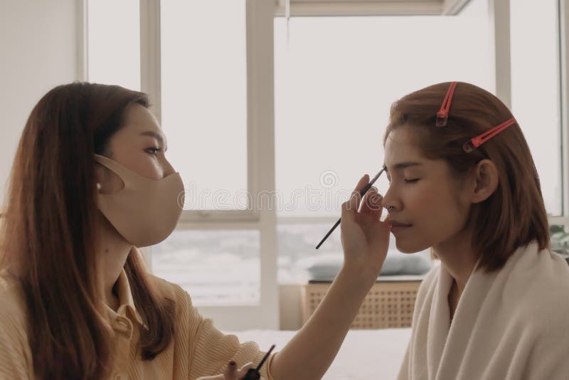 Makeup Artist is Applying Makeup on Client Eyes. Stock Photo - Image of ...