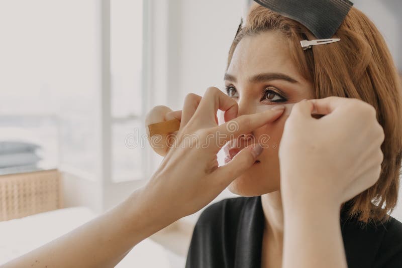 Makeup Artist is Applying Makeup on Client Eyes. Stock Photo - Image of ...