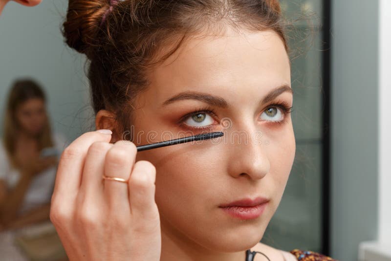 Makeup Artist Creates Voluminous Eyelashes of the Model Stock Photo ...