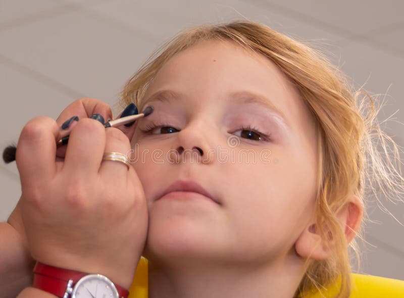 A Makeup Artist Makes Makeup for a Child Stock Image - Image of child ...