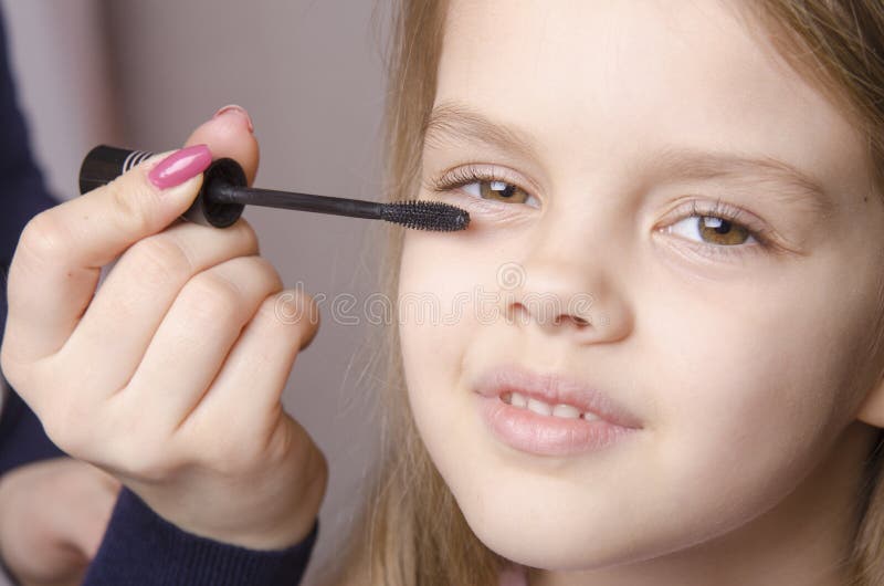 Makeup Artist Paints Eyelashes on Girl S Face Stock Photo - Image of ...