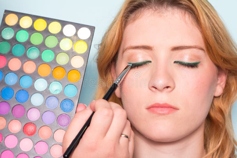 Makeup Artist Paints a Eyes of Woman. Makeup. Stock Photo - Image of ...