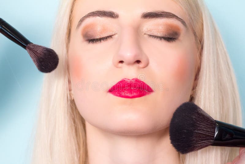 Makeup Artist Paints a Woman Blush Cheekbones. Makeup. Stock Image ...