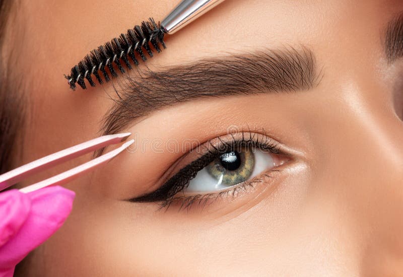 Makeup Artist Plucks Eyebrows. Long-lasting Styling of the Eyebrows and ...
