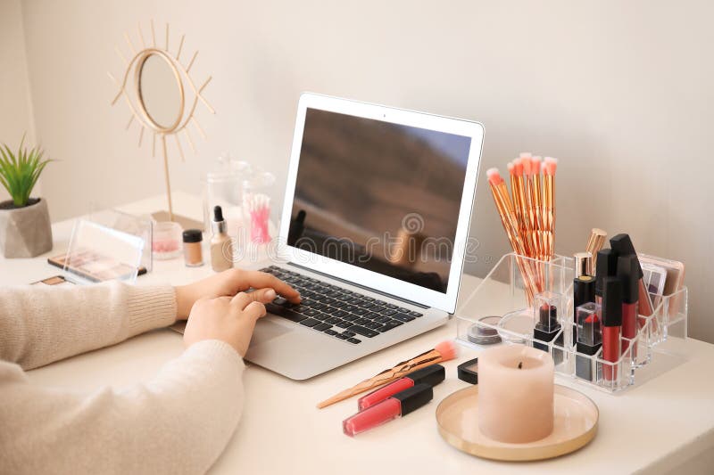 Makeup Artist at Table with Modern Laptop and Cosmetics Stock Image ...