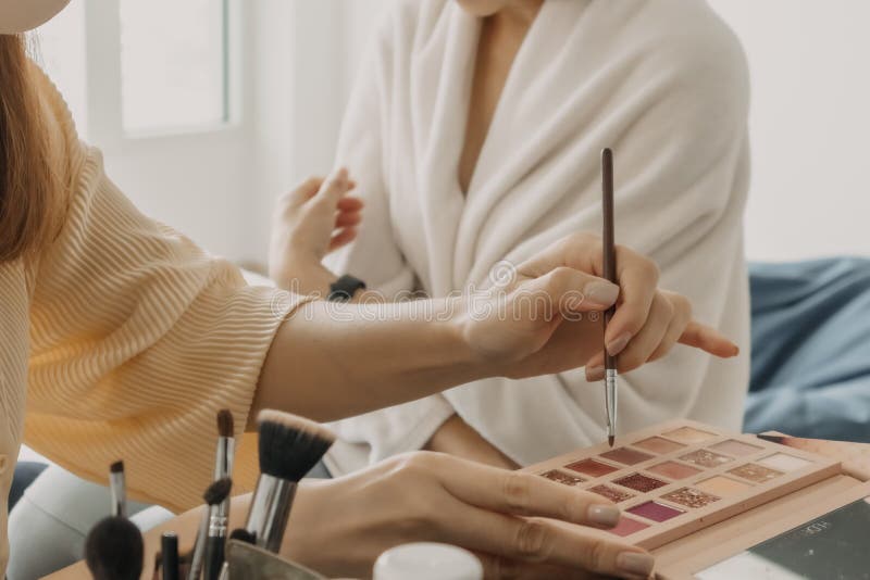 Makeup Artist is Using Makeup Tools Applying To the Client. Stock Image ...