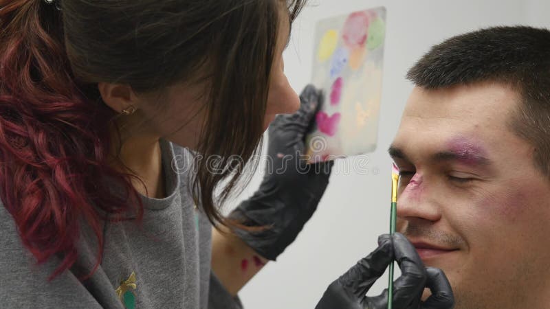 Makeup Artist at Work Applying Special Effects Makeup Stock Footage ...
