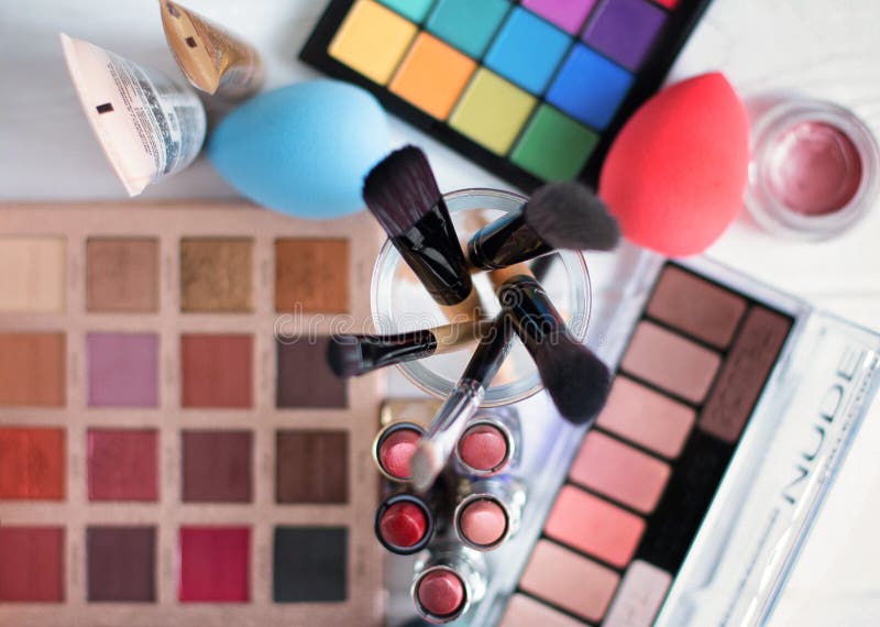 Makeup Brush and Cosmetics on White Wooden Table. Top View Stock Image ...