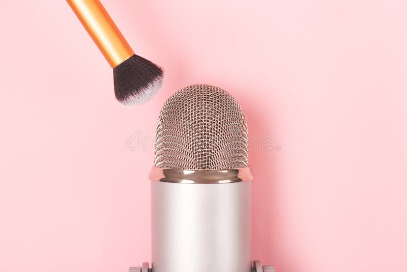 A Makeup Brush and a Professional Microphone on Pink Backround. Making ...